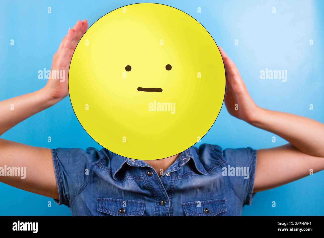 Unrecognizable woman with sad smiley instead of face Stock Photo - Alamy