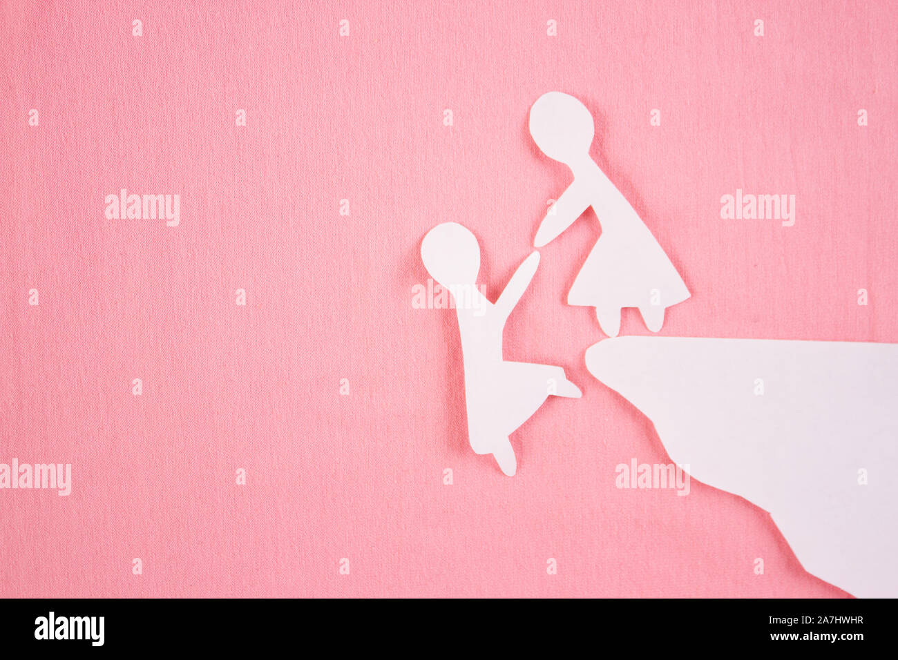 Female solidarity concept. Two paper woman helping each other Stock ...