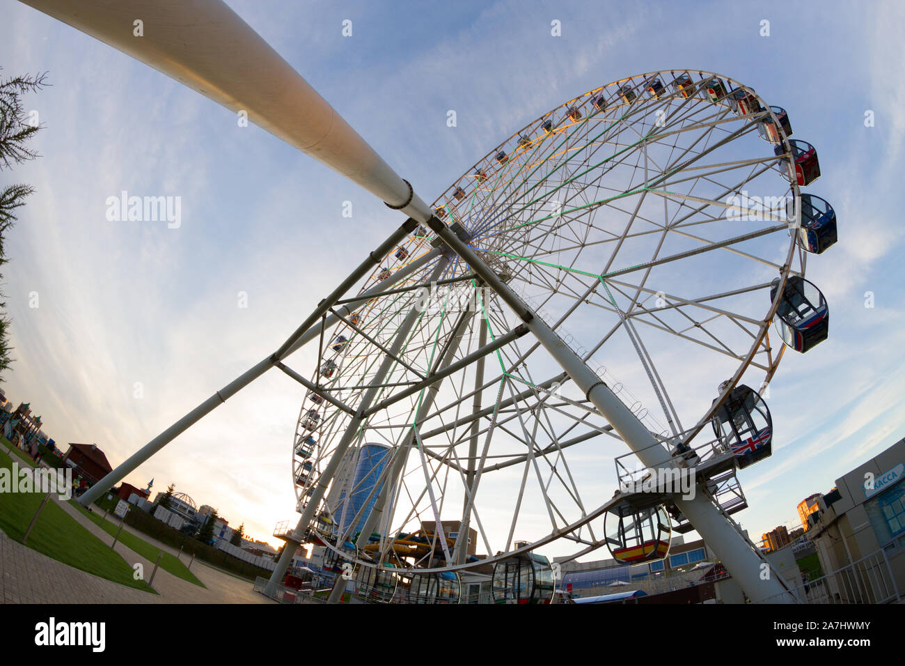 Ferris wheel in amusement park. fisheye lens Stock Photo - Alamy