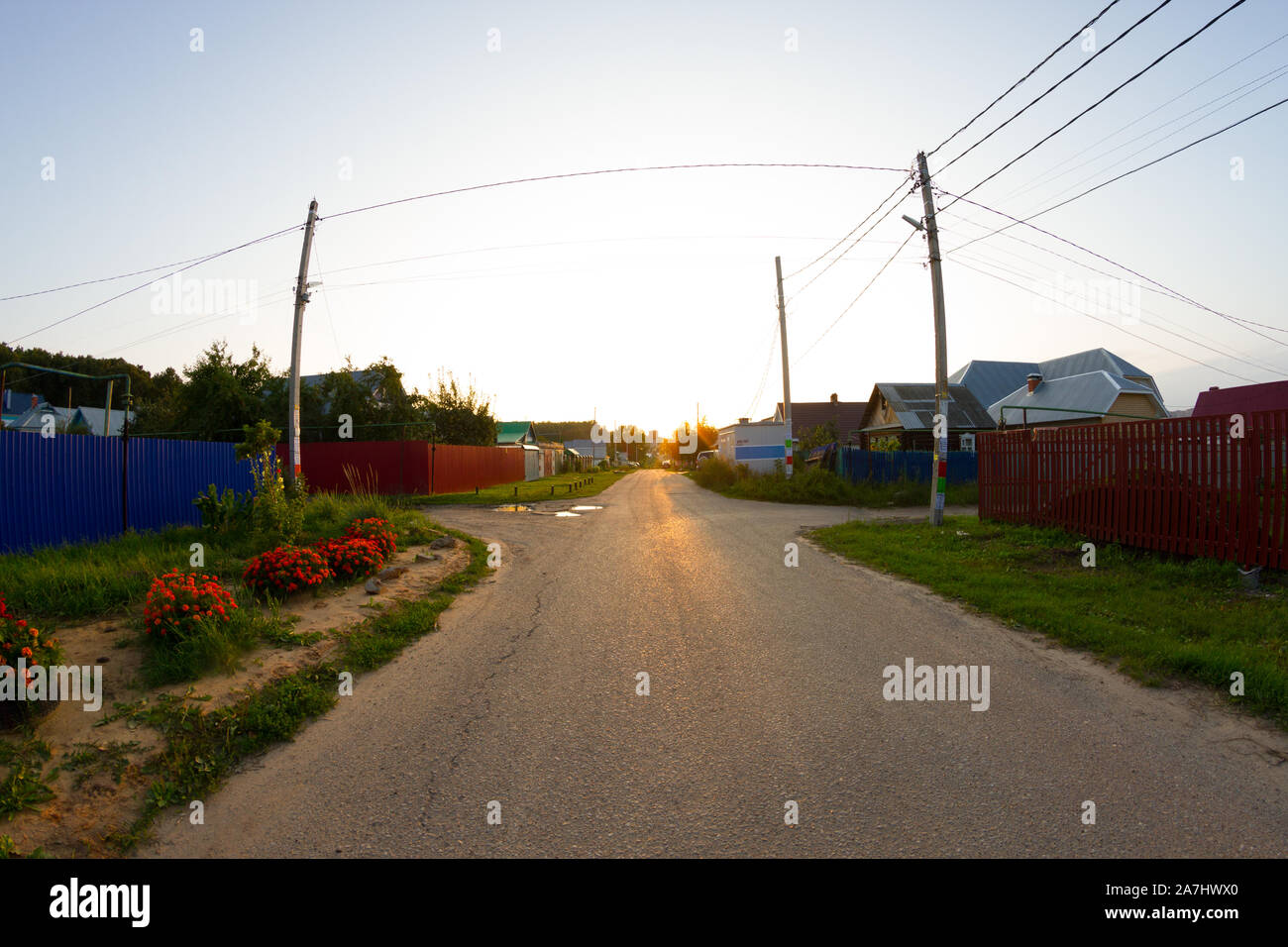 Road in a village. Old poor country houses Stock Photo - Alamy