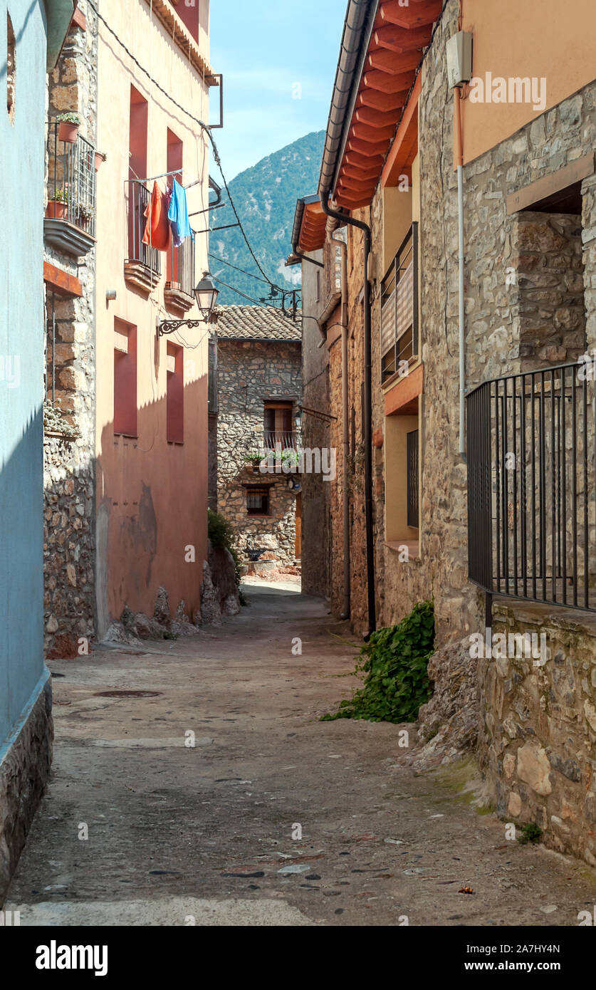 Rural village in Catalonia with the mountains of the Pyrenees in the ...