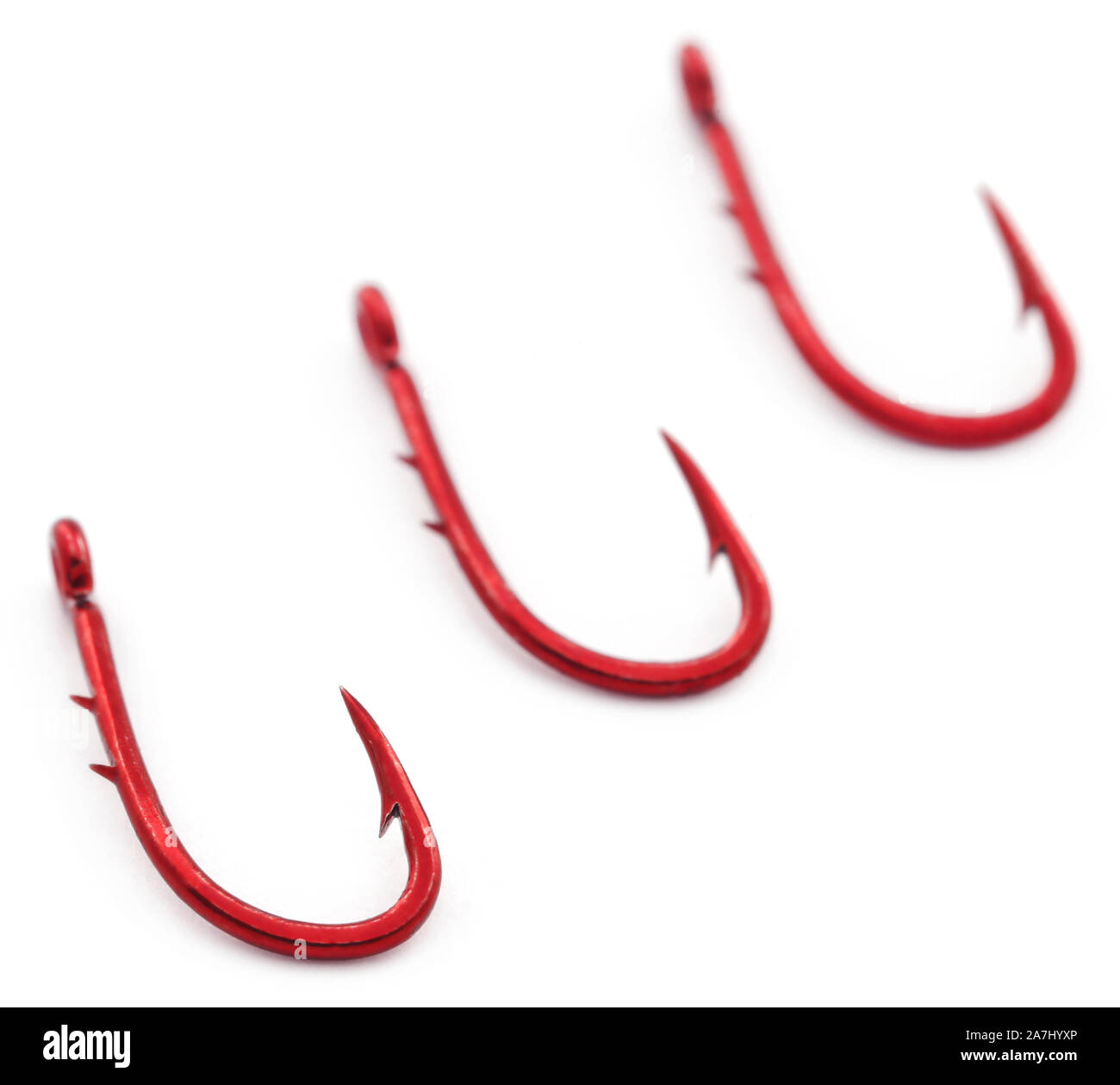 Bait holder hooks isolated over white background Stock Photo - Alamy