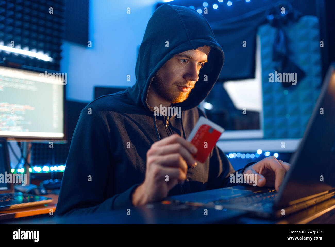 Hacker shows bank credit card, finance hacking Stock Photo - Alamy