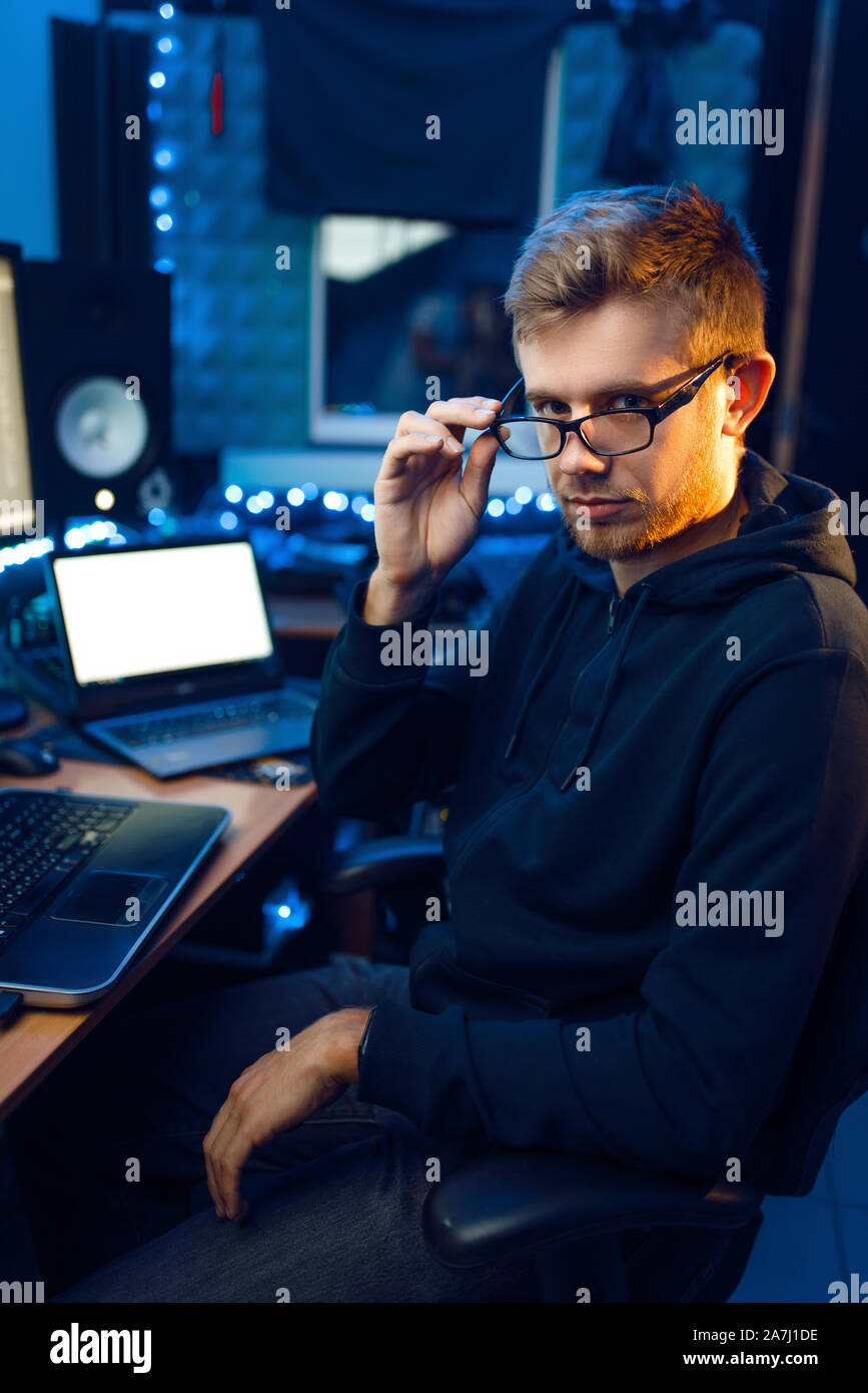 Hacker in hood at his workplace, corporate hacking Stock Photo - Alamy