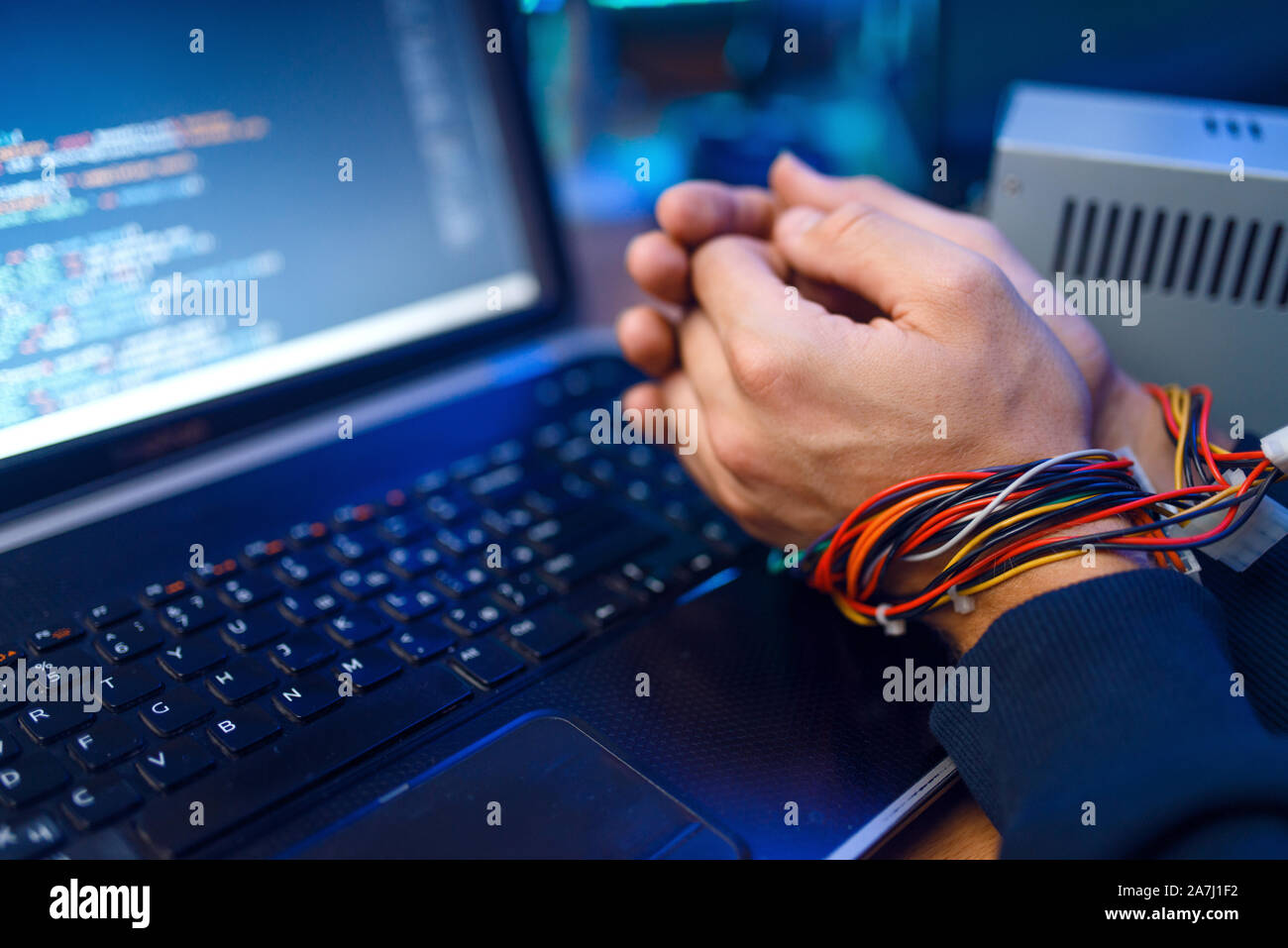 Hacker hands tied with wires, crime lifestyle Stock Photo - Alamy