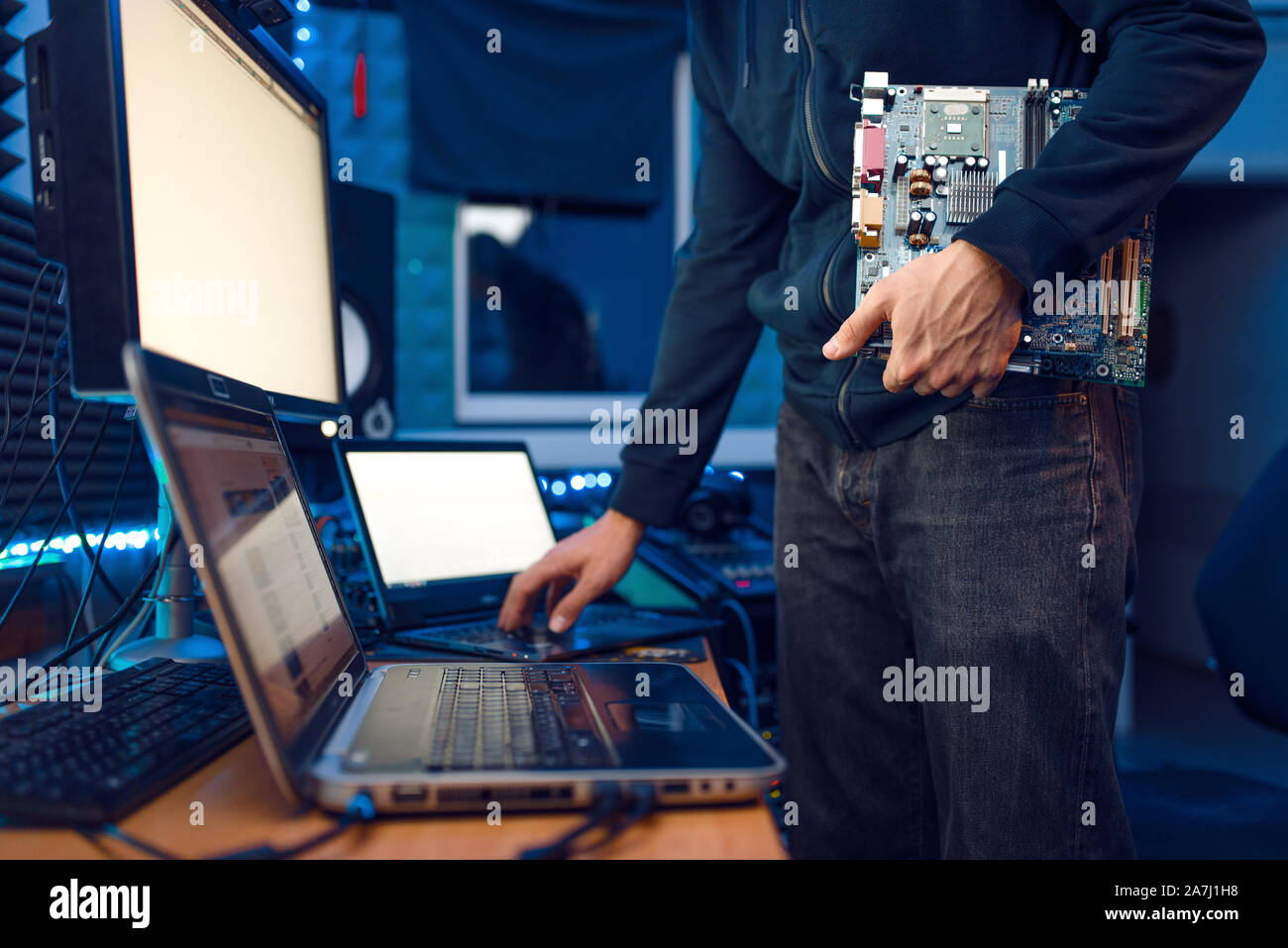 Computer engineer holds PC motherboard Stock Photo - Alamy