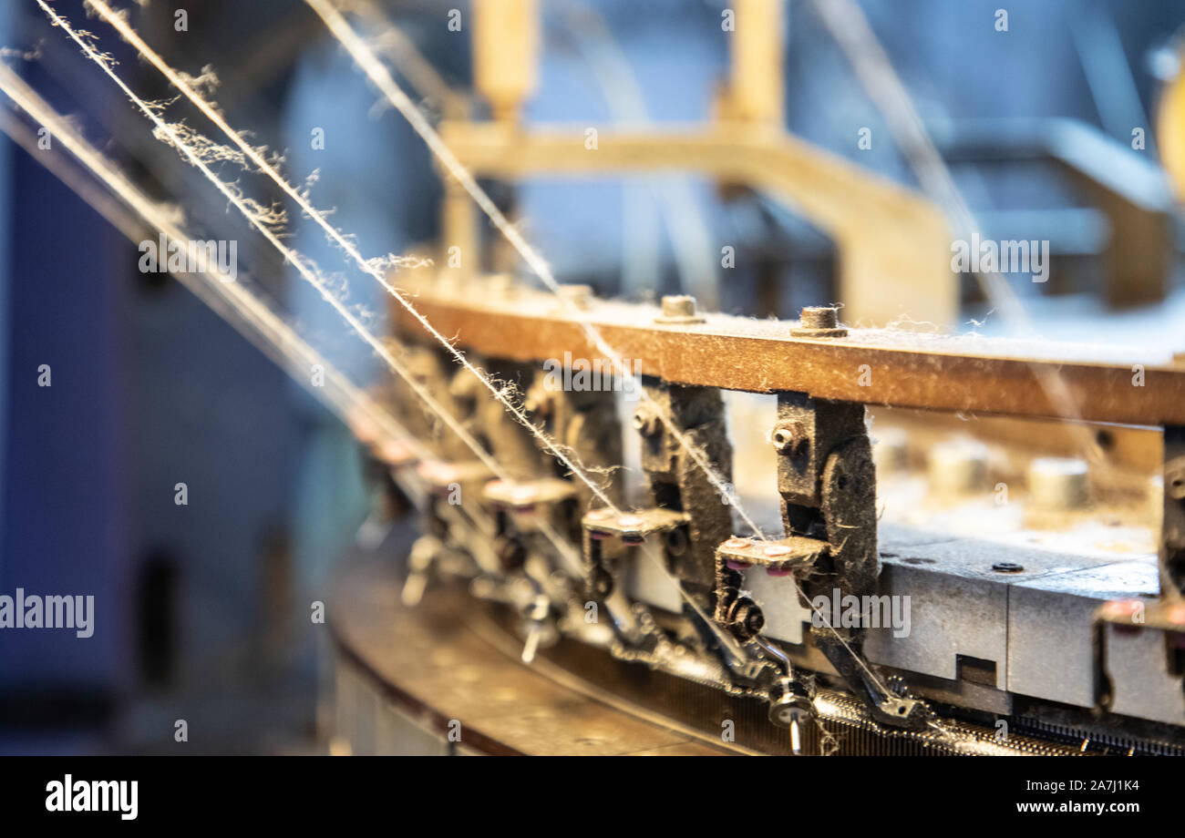 Carpet weaving machine with cotton thread closeup Stock Photo - Alamy