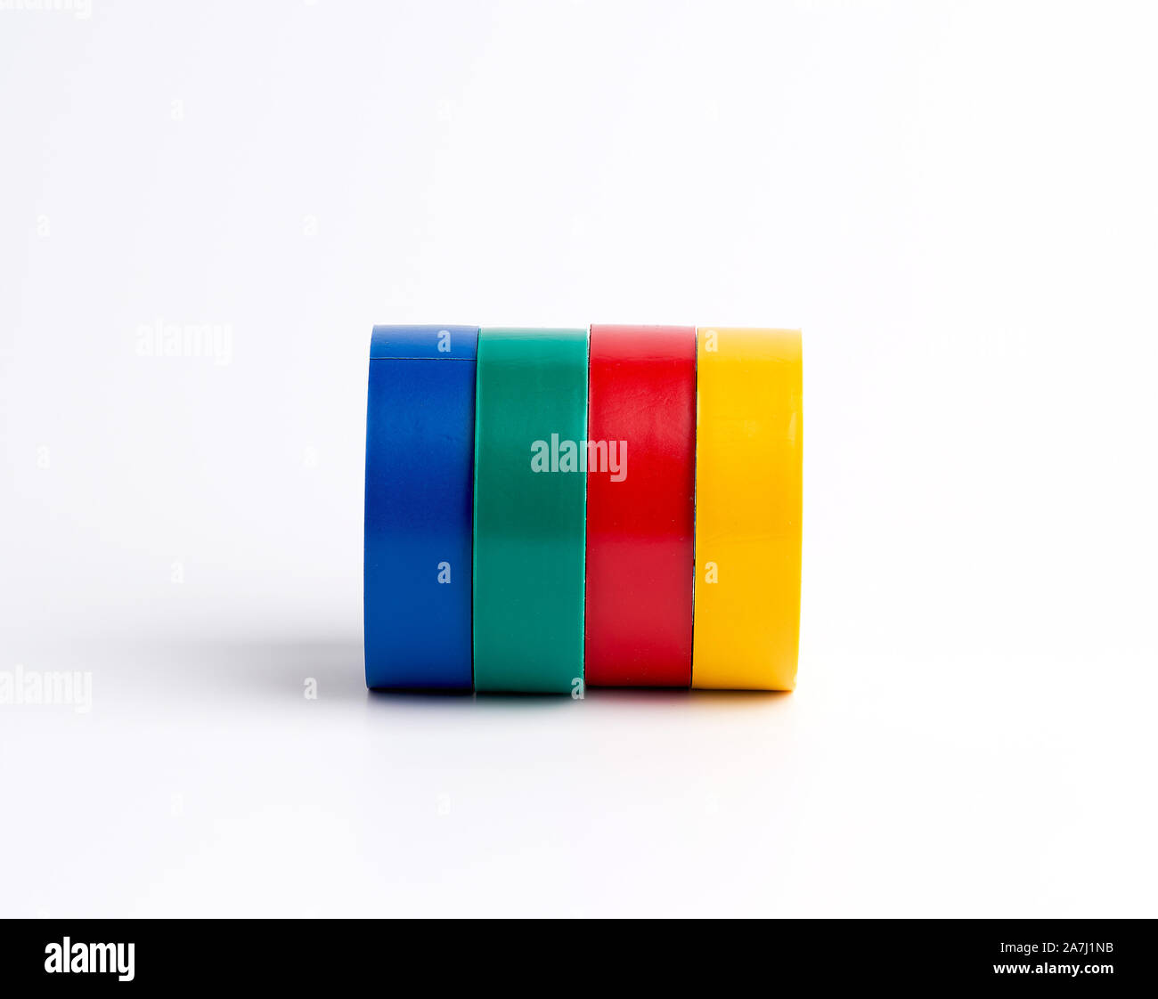 full coils of multi-colored insulating tape on a white background, copy ...