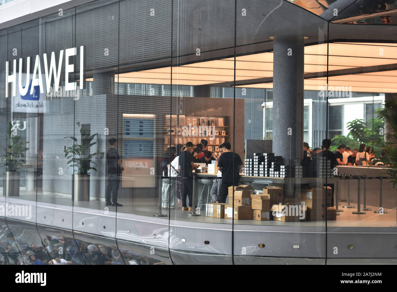 Consumers flock to get inside and experience the first Huawei's global ...
