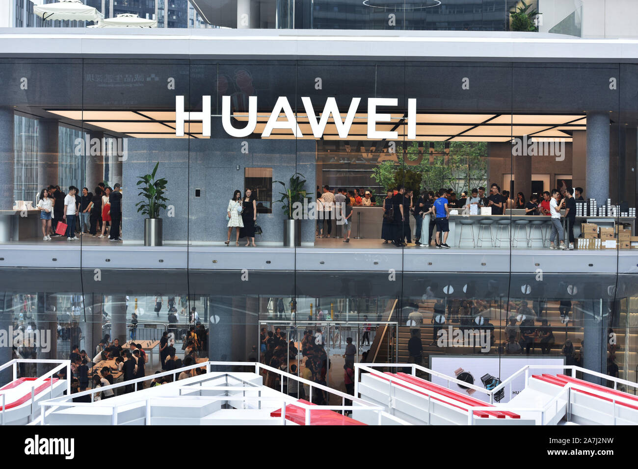 Consumers flock to get inside and experience the first Huawei's global ...