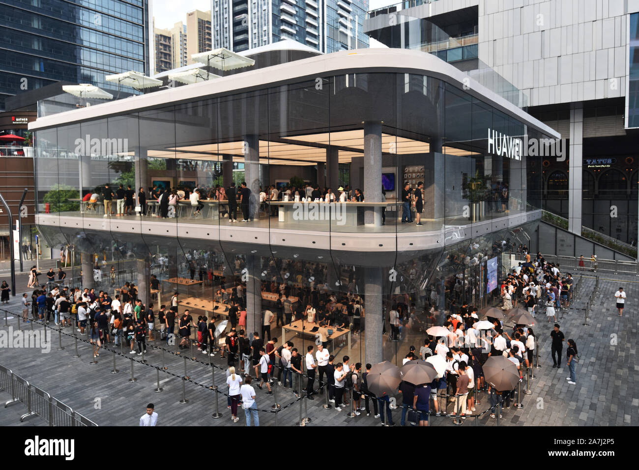 Consumers flock to get inside and experience the first Huawei's global ...