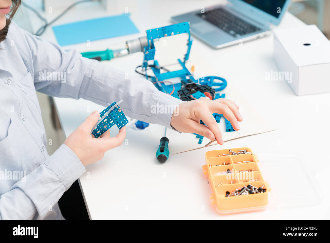 Student woman in robotics laboratory working on project mechatronics ...