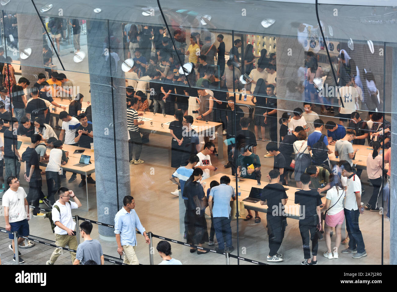 Consumers flock to get inside and experience the first Huawei's global ...