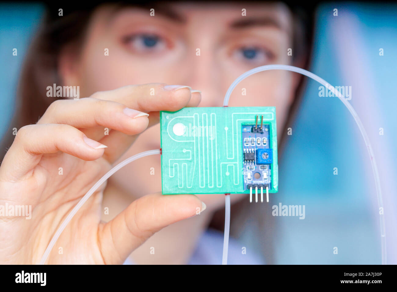 Girl holding polymers Bio-MEMS biomedical microelectromechanical ...