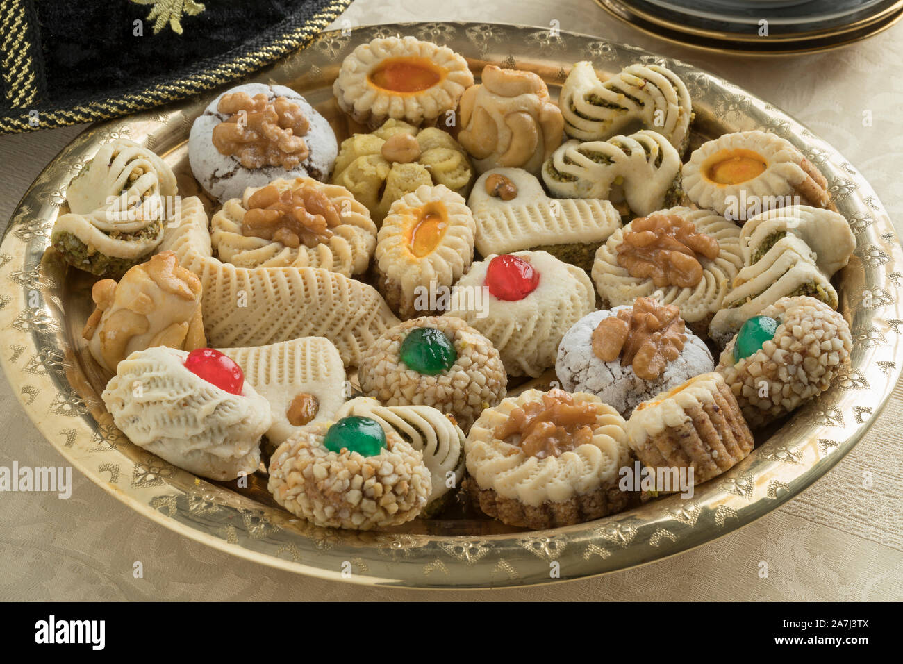 Diversity of traditional festive Moroccan cookies on a tagine dish ...