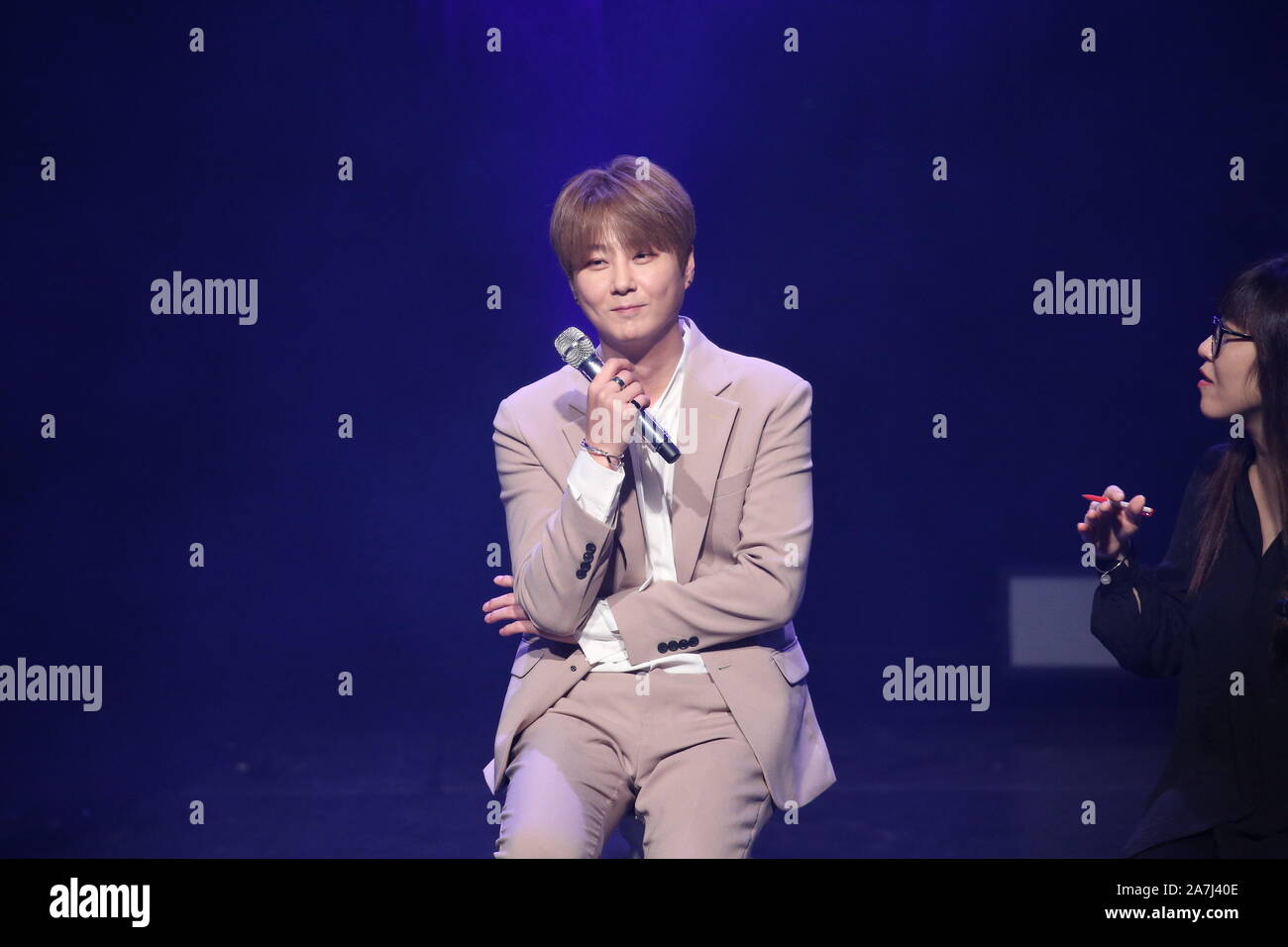 South Korean singer Shin Hye-sung of Korean boy group Shinhwa interacts ...