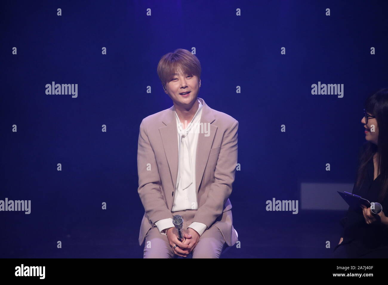 South Korean singer Shin Hye-sung of Korean boy group Shinhwa interacts ...