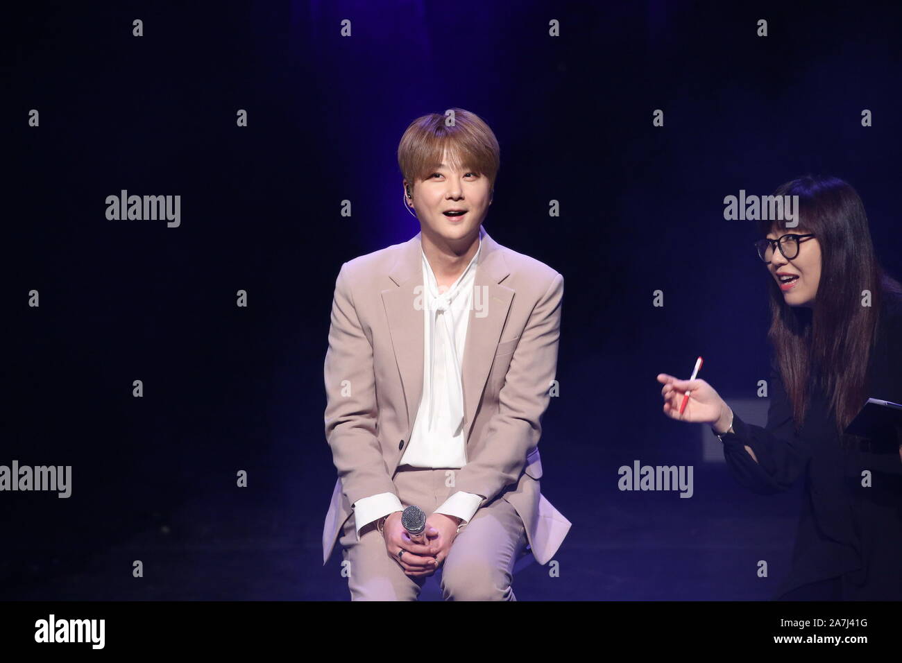 South Korean singer Shin Hye-sung of Korean boy group Shinhwa interacts ...