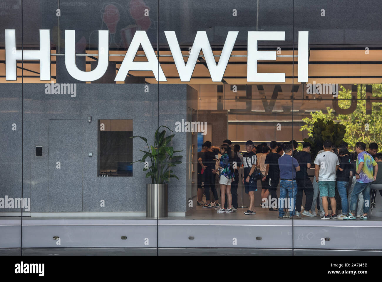 Consumers flock to get inside and experience the first Huawei's global ...