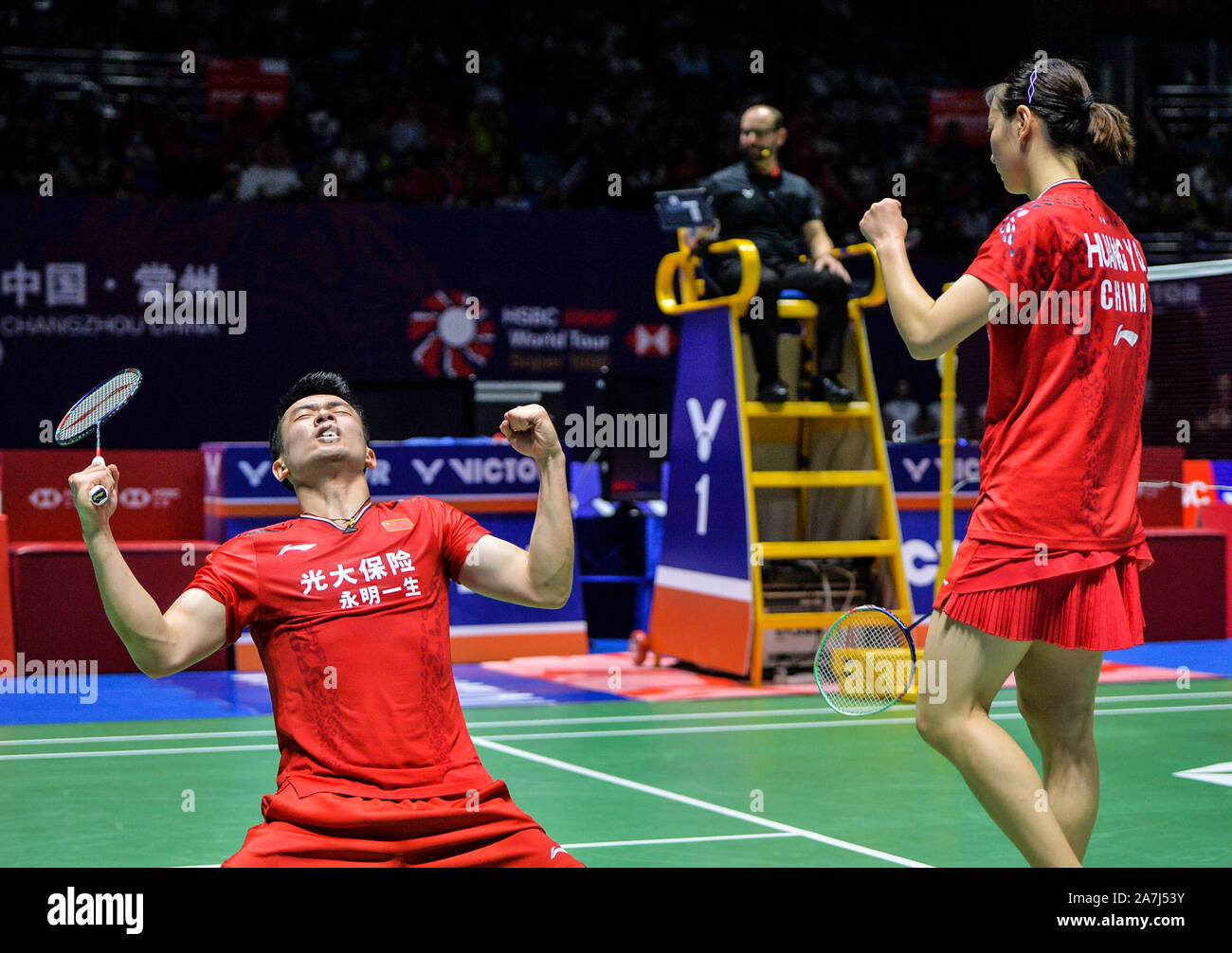 Chinese professional badminton players Zheng Siwei and Huang Yaqiong compete against Chinese ...