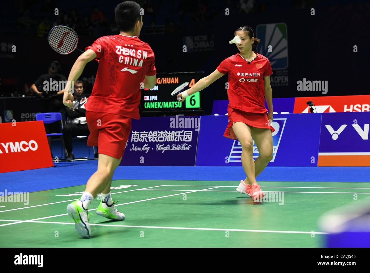 Chinese professional badminton players Zheng Siwei and Huang Yaqiong compete against Japanese ...