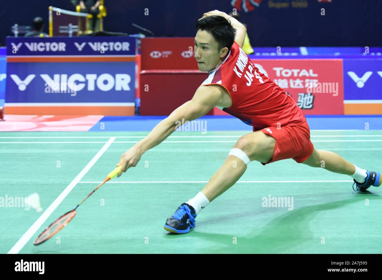 Japanese professional badminton player Kento Momota competes against ...