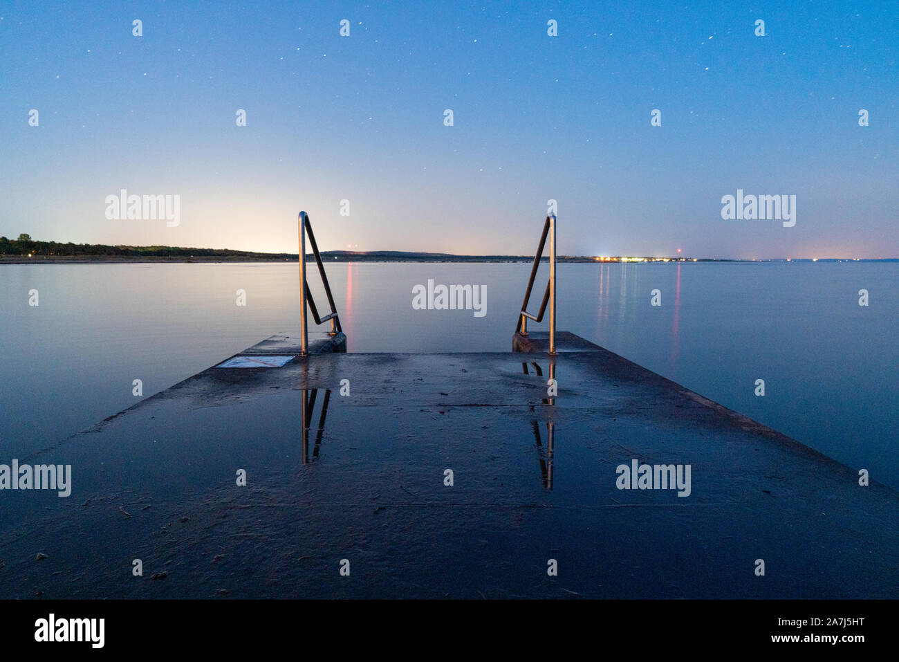 Pier at Midnight in Haverdal, Sweden Stock Photo - Alamy