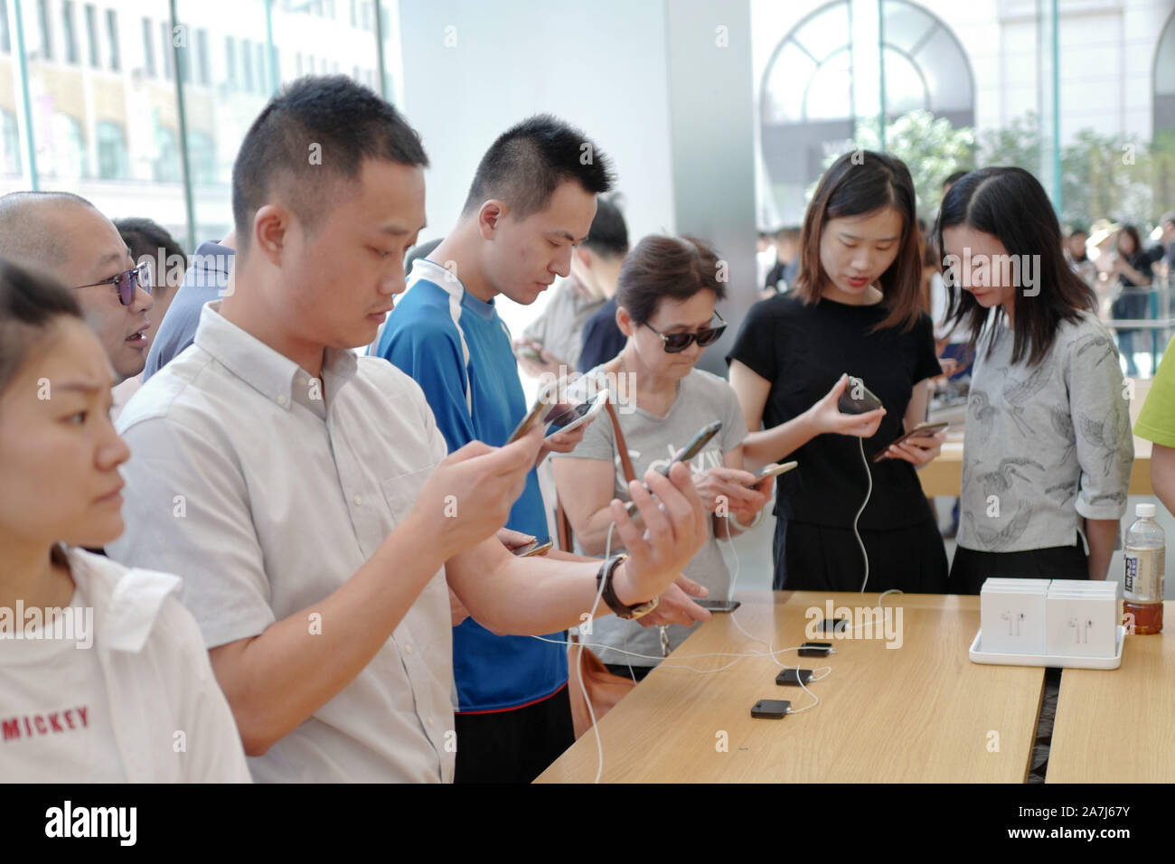Customers try out iPhone 11 series smartphones at the East Nanjing Road ...
