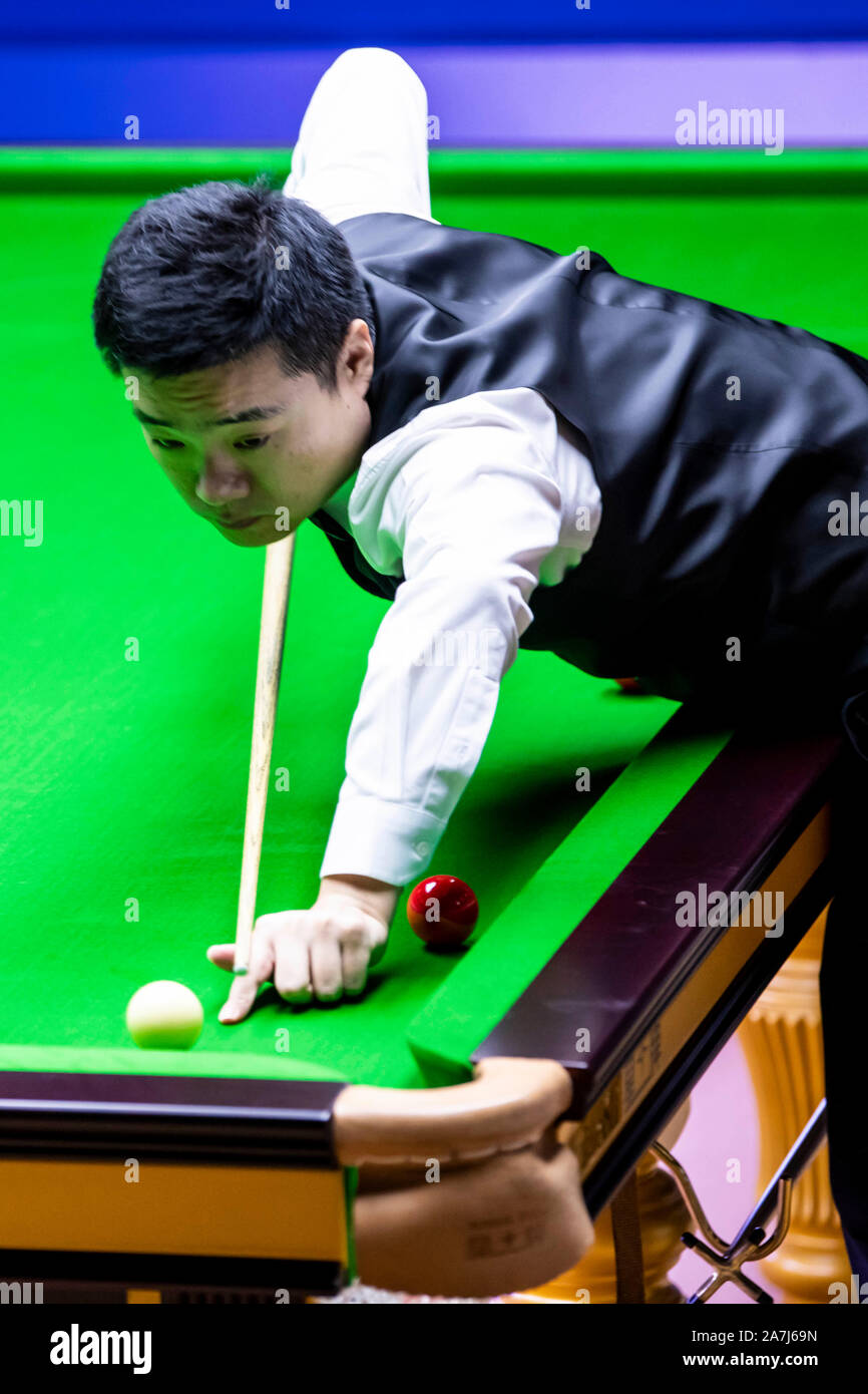 Chinese professional snooker player Ding Junhui plays a shot at the ...