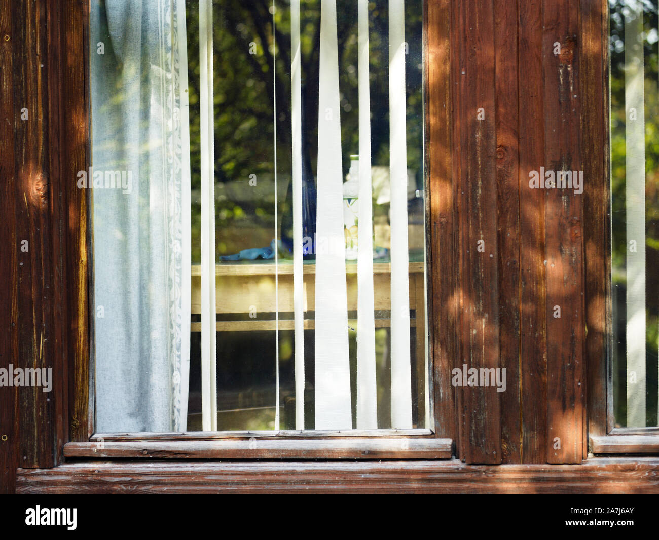 Blinds on the window of wooden house, outdoor framed shot Stock Photo ...