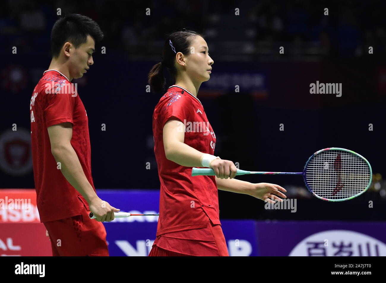 Chinese professional badminton players Zheng Siwei and Huang Yaqiong compete against Chinese ...