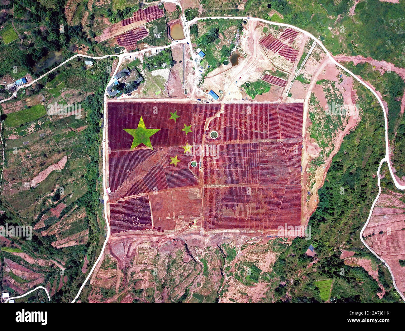 An aerial view of the large national flag of 125 acres compsed by ...