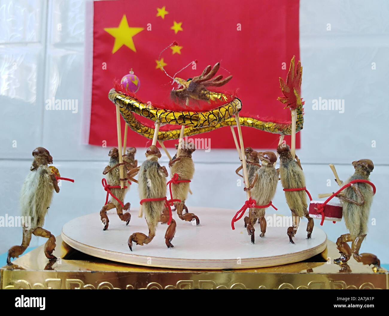 Zhang Zhenwu, a 70-year old Chinese, shows his cicadae monkeys made of ...