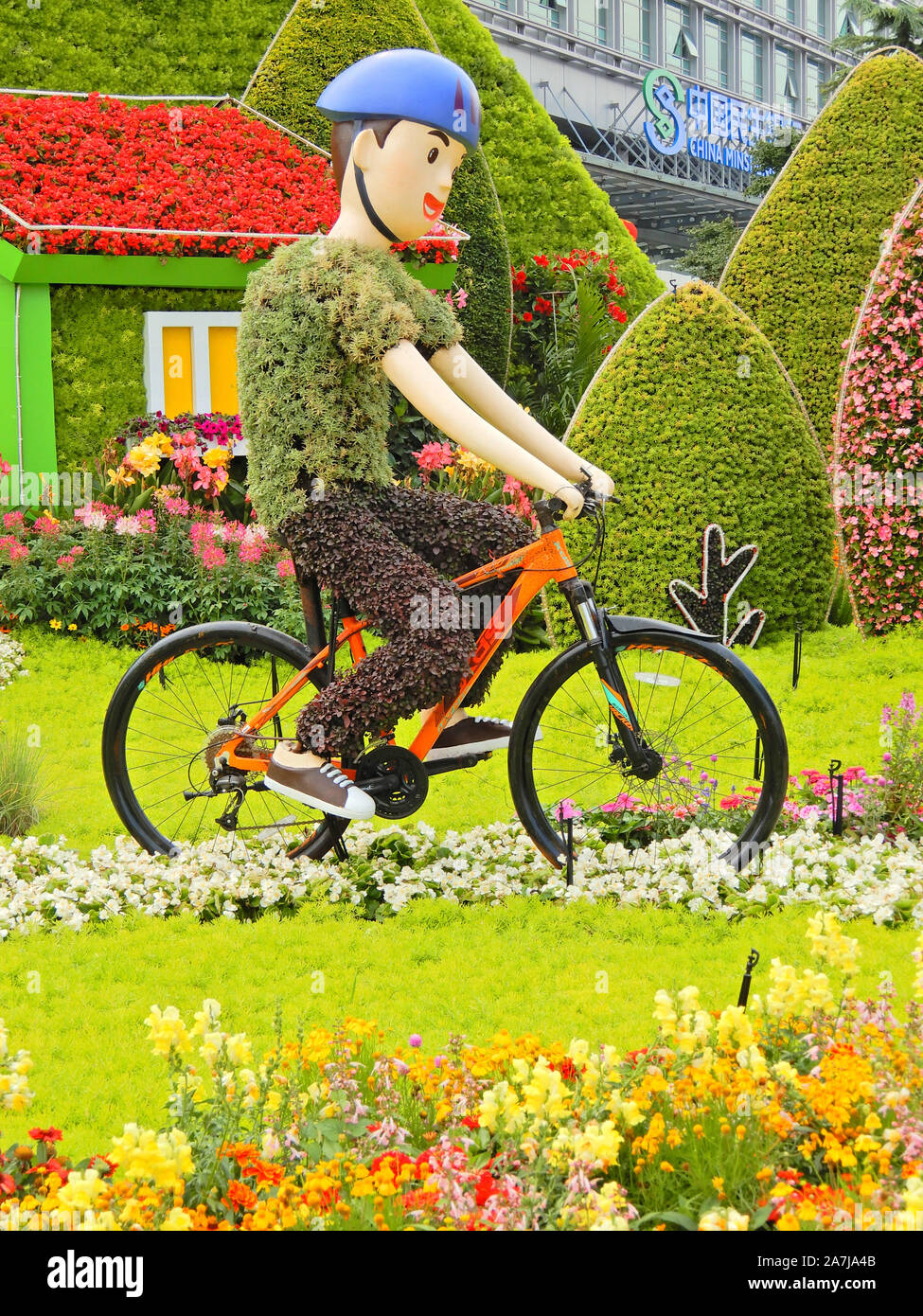 Picure of a biker mosaiculture on the Changan Boulevard in Beijing ...