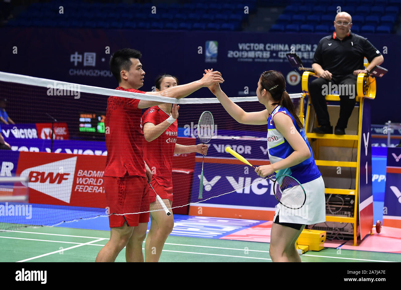 Chinese professional badminton players Zheng Siwei and Huang Yaqiong compete against Japanese ...