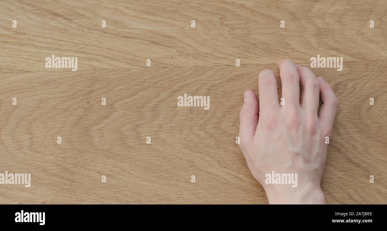 Top view man hand finger tapping on oak wood surface, wide photo Stock ...