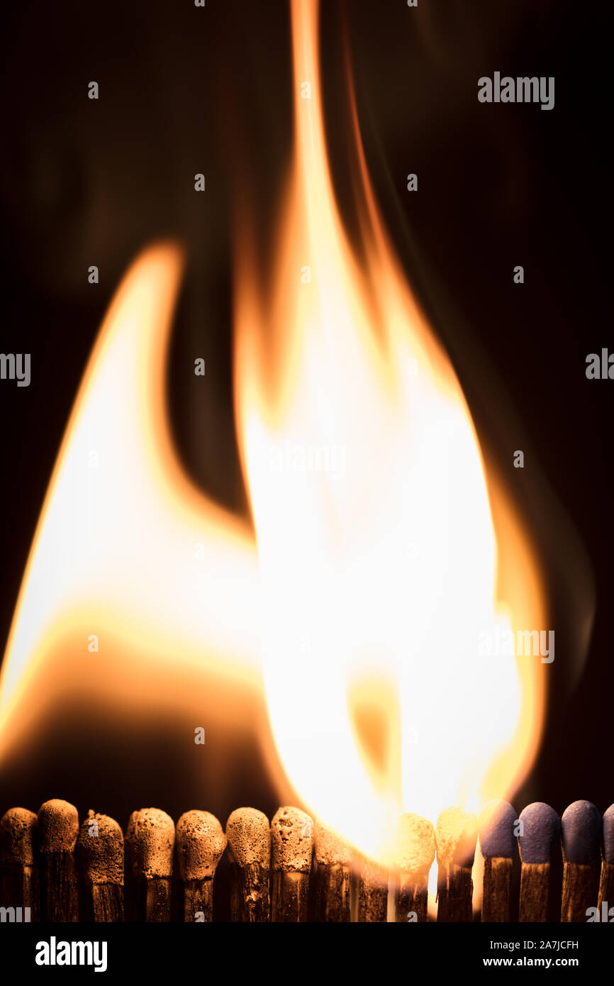 blue matchsticks with black background, flames and fire Stock Photo - Alamy