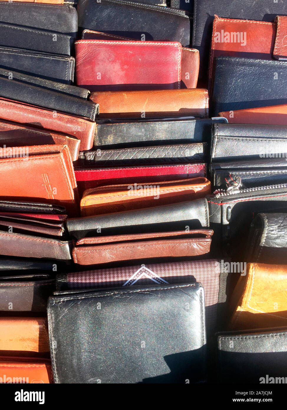 Piled leather wallets in a flea market Stock Photo - Alamy