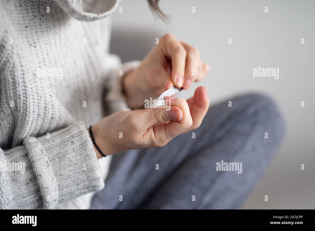 Woman filing her nails Stock Photo - Alamy