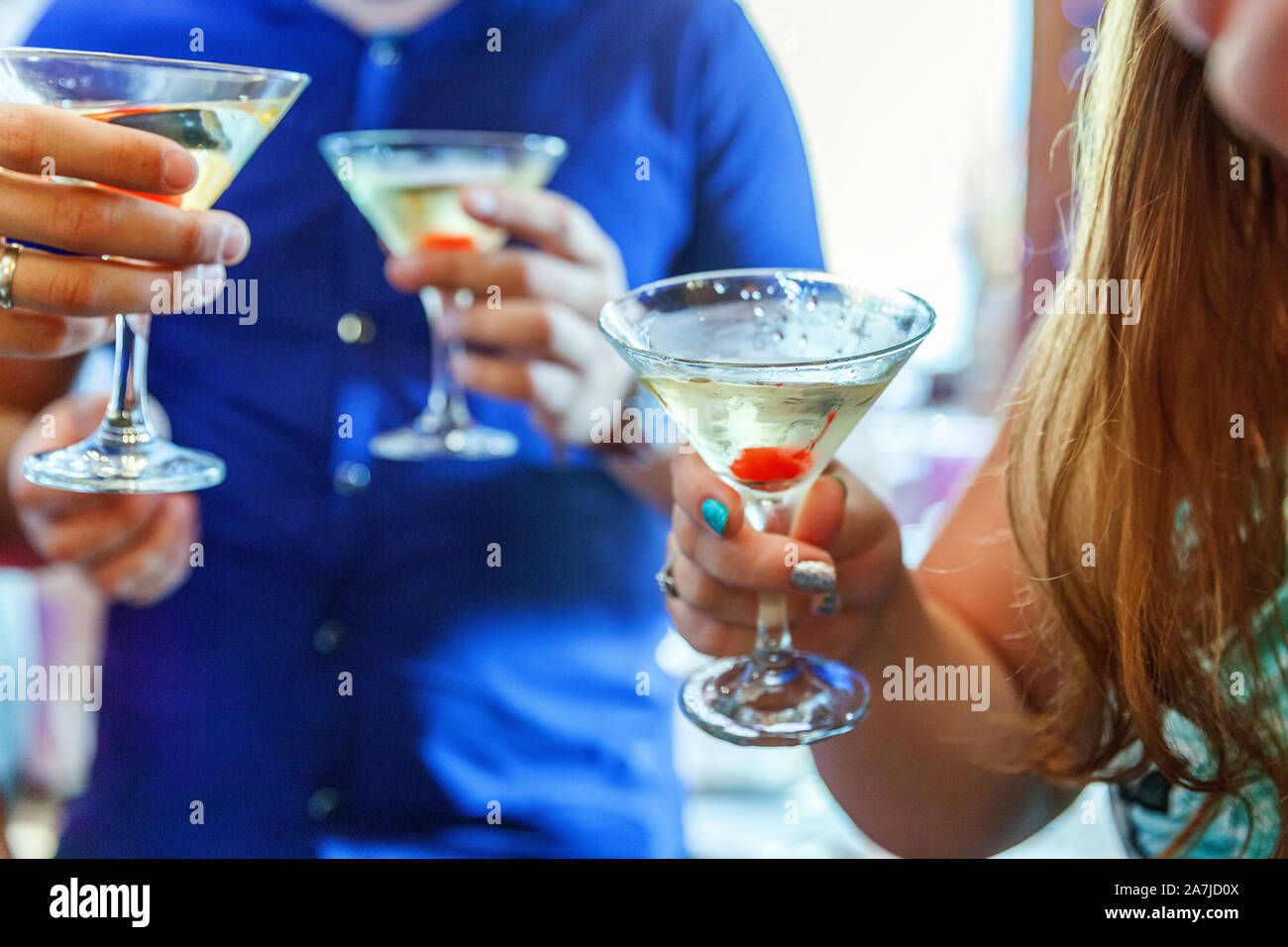 Cheers. Group of people drinking and toasting in restaurant. Hands ...