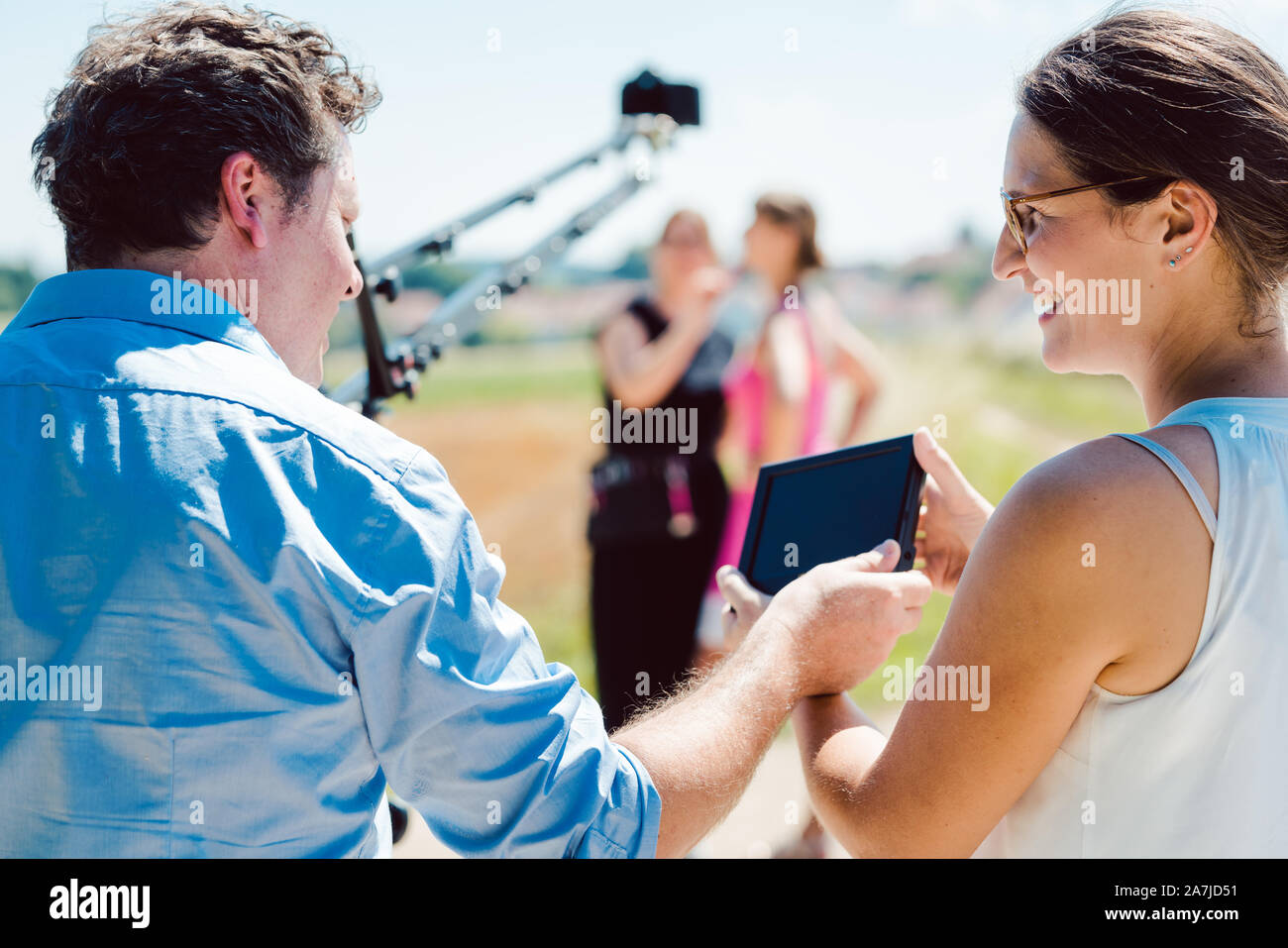 Cameraman with camera on a crane on video production set Stock Photo ...