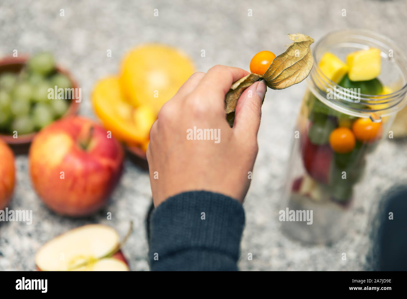 woman is preparing a lot of fruits for a fresh smoothie Stock Photo - Alamy