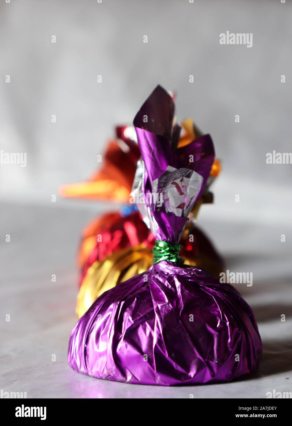 Chocolates in colourful wrapper hi-res stock photography and images - Alamy