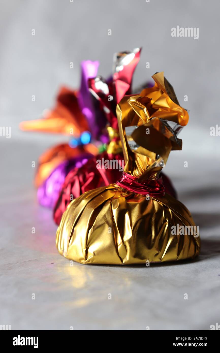 Chocolates in colourful wrapper hi-res stock photography and images - Alamy