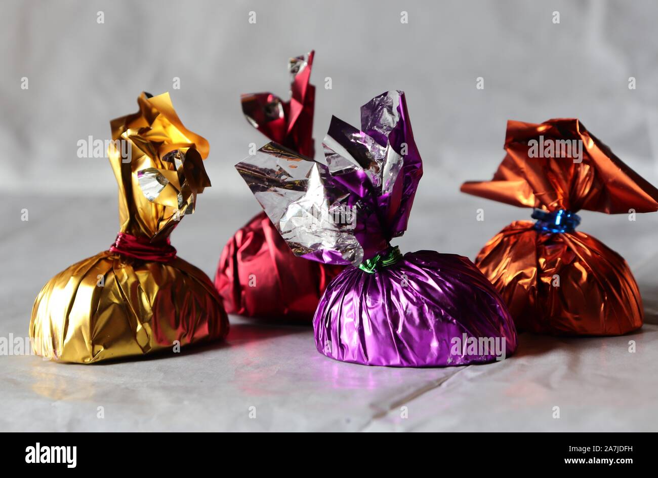 Chocolates in colourful wrapper hi-res stock photography and images - Alamy