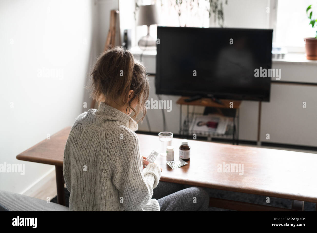 Sick ill girl sitting home hi-res stock photography and images - Alamy