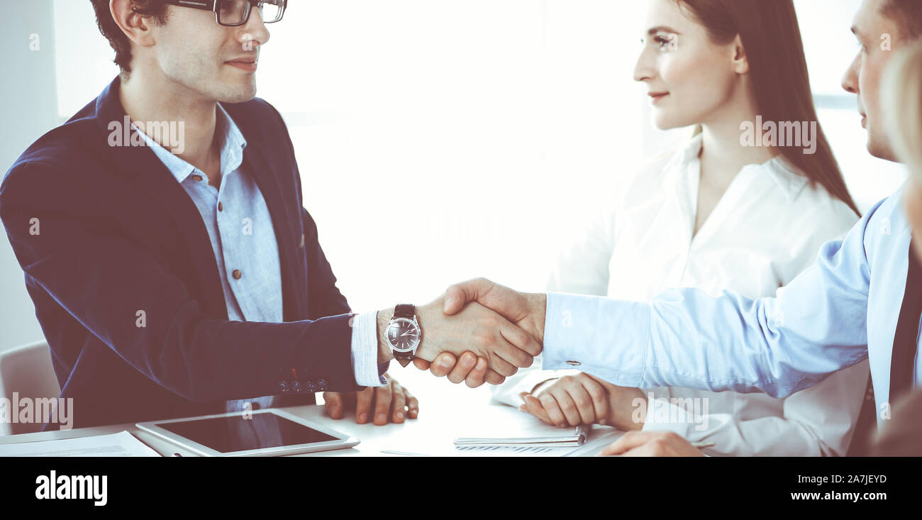 Business people shaking hands at meeting or negotiation. Group of ...