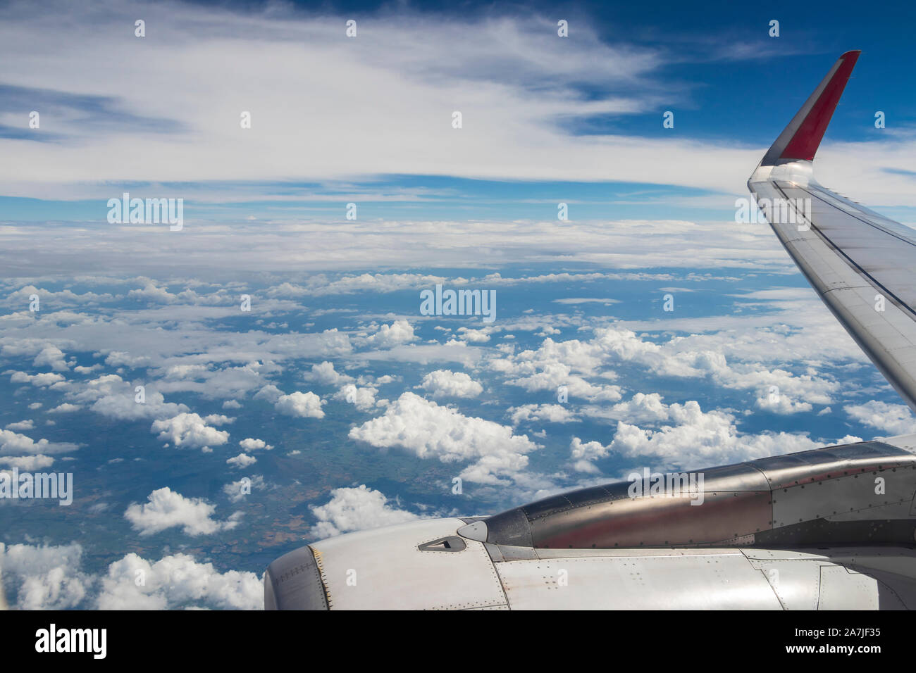 Flight and view over Bangkok in Thailand with clouds and city panorama ...