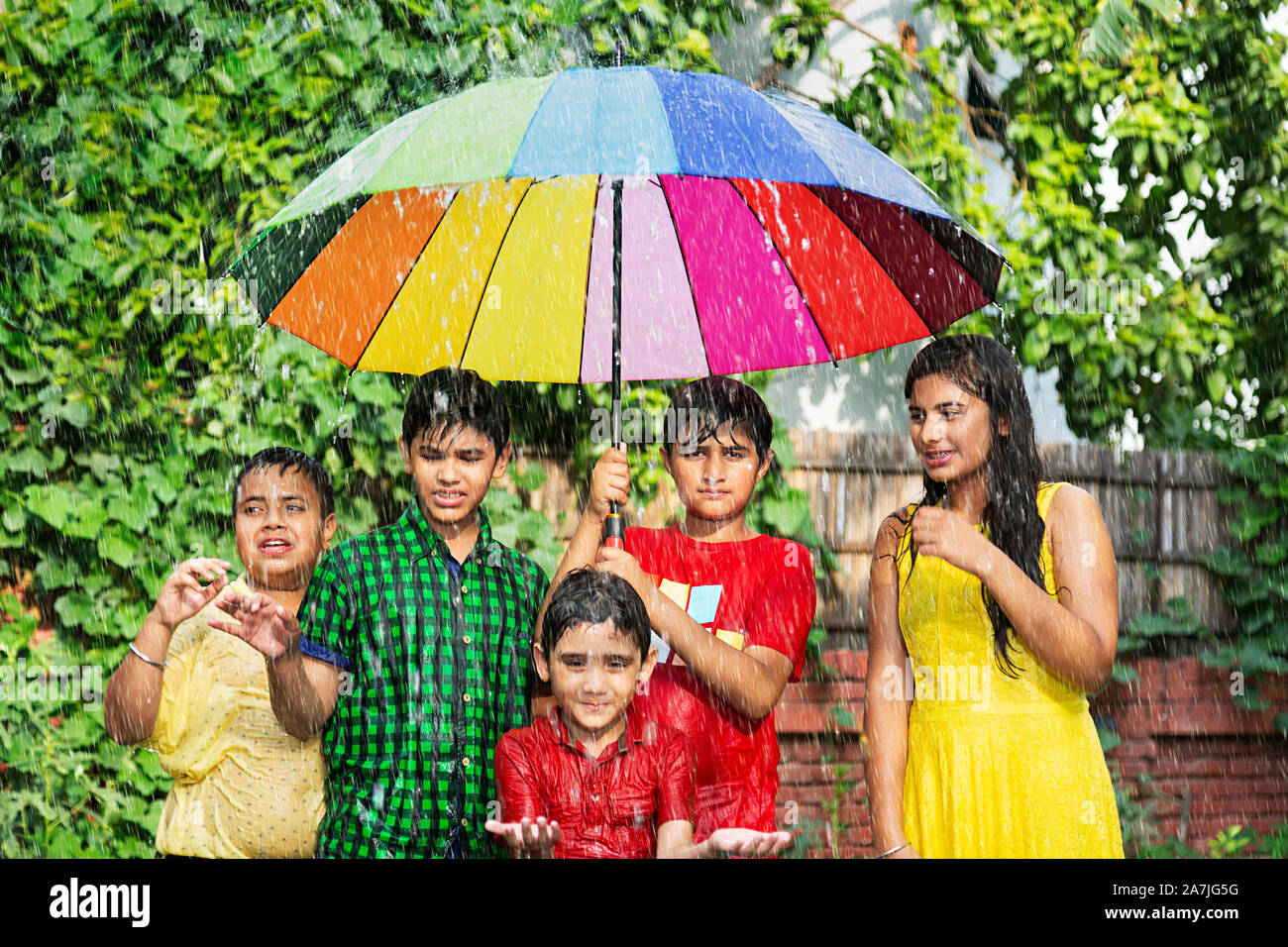 Raining Playing Children Stock Photos & Raining Playing Children Stock ...