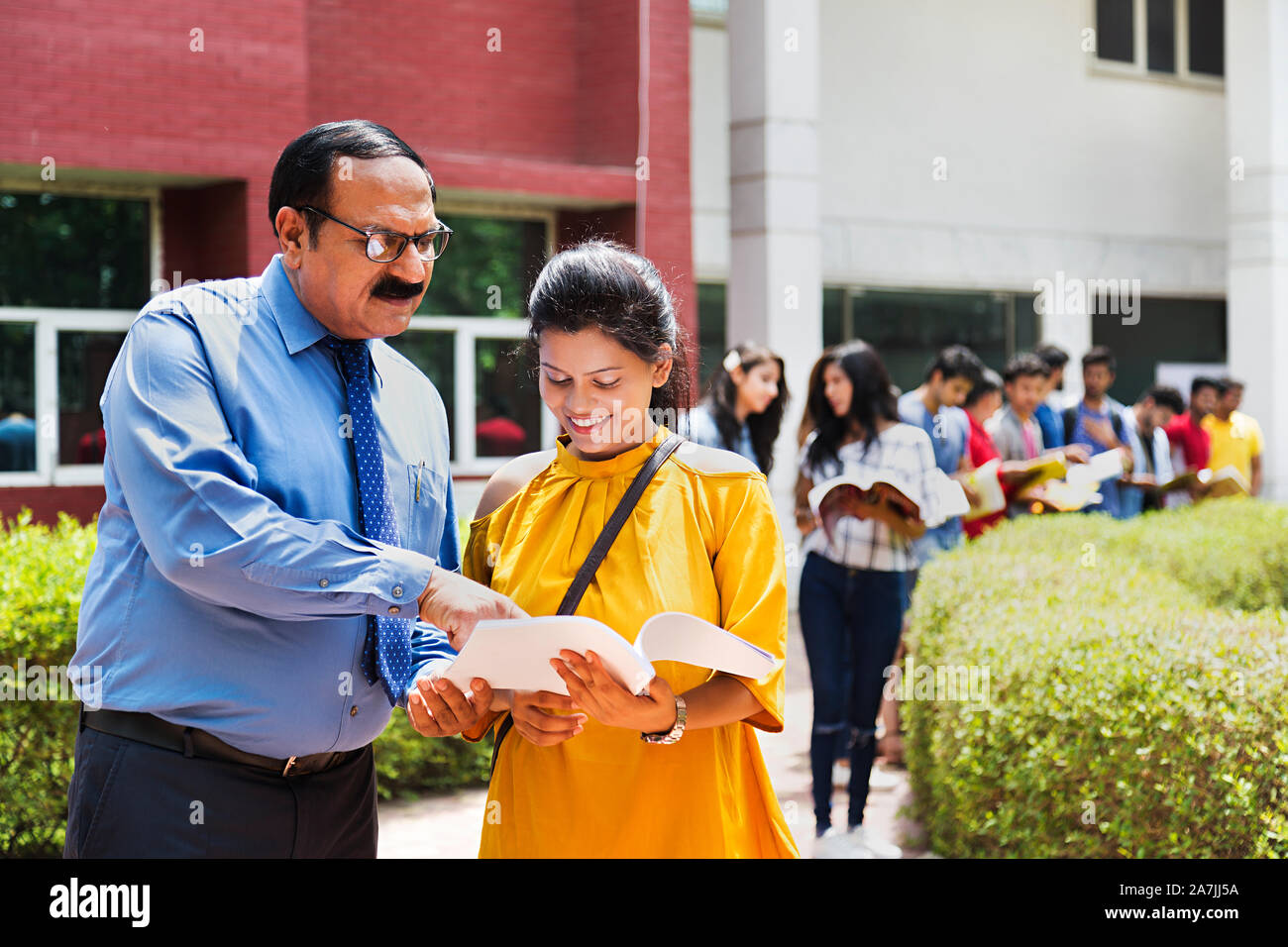 Young College Girl Student With Professor Reading Book Studying In ...